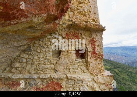 Chullpas of the Chachapoya culture nestled in the limestone cliffs of ...