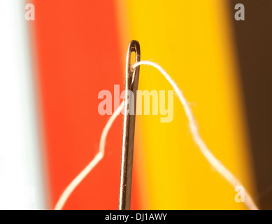 needle with thread going through eye needles small hole difficult ...