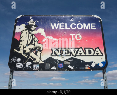 Welcome to Nevada road sign with bullet holes Stock Photo - Alamy