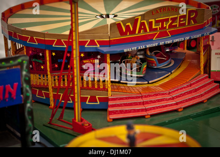 A model of a colourful Waltzer fairground ride Stock Photo - Alamy