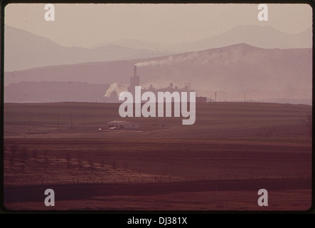 AIR IS POLLUTED BY EMISSIONS FROM CEMENT PLANT Stock Photo - Alamy