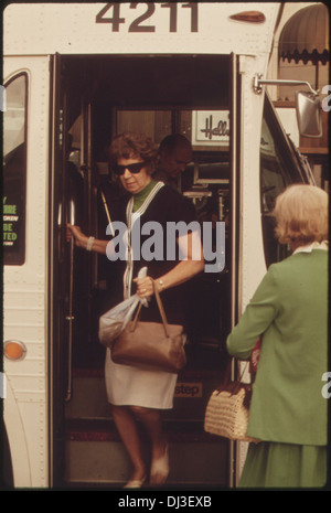 This photograph captures passengers boarding a MARTA bus in downtown ...
