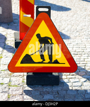 Closeup of a work in progress caution turn sign in Milan, Italy Stock ...