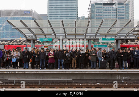 Crowded platform at the Poplar DLR station. Commuters waiting for a ...