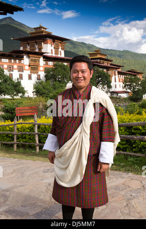 A Bhutanese man wearing traditional Kabney silk scarf worn as a part of ...