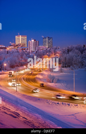 Alpenglow Over The Anchorage Skyline With The Lights From Traffic On ...