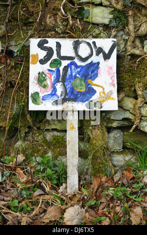 Hand-painted 'SLOW' sign. Crook, Lake District National Park, Cumbria ...