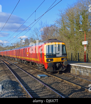 Royal Mail Class 325 parcels train at speed, passing Oxenholme Rail ...