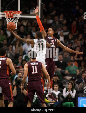 Michigan State's Keith Appling (11) shoots over Duke's Tyler Thornton ...