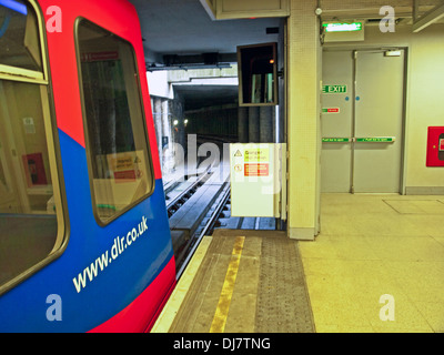 Interior of Woolwich Arsenal DLR Station showing DLR train at platform ...