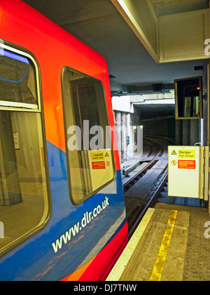 Interior of Woolwich Arsenal DLR Station showing DLR train at platform ...