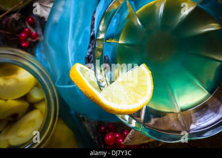 Tincture of quince cups. Fruits in a jar on wooden background Stock ...