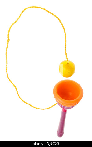 wooden Cup-and-ball (ball in cup) toy close up isolated on white ...