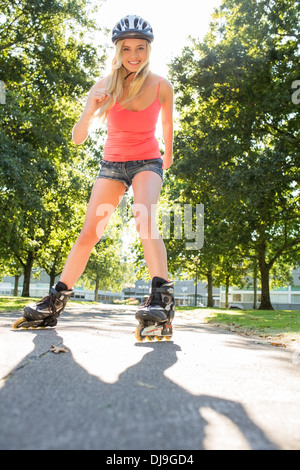 Inline skating on path Stock Photo - Alamy