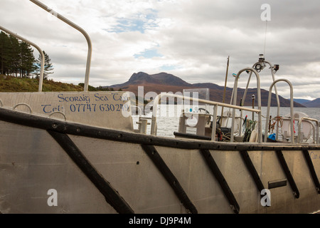 The boat that ferries supplies across to Scoraig, in NW Scotland, one ...
