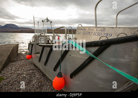 The boat that ferries supplies across to Scoraig, in NW Scotland, one ...