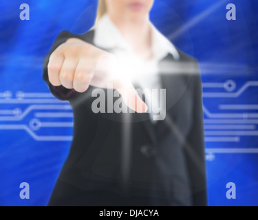 Composite image of businesswoman pointing up Stock Photo - Alamy