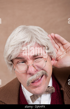 Portrait of adult man eavesdrop with hearing gesture listen shock news ...