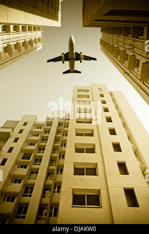 Airplane flying over a Building, Pune, Maharashtra, India Stock Photo ...