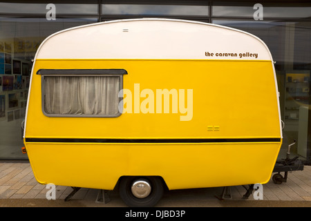 Bright Yellow Touring Caravan Art Gallery Stock Photo - Alamy