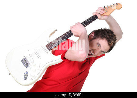 Man smashing guitar Stock Photo: 15721107 - Alamy
