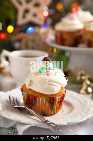 Christmas tree ornament and cupcake with snowman Stock Photo - Alamy