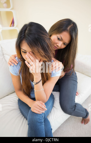 Distressed Woman Crying on Sofa Stock Photo - Alamy