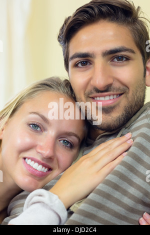 Beautiful couple in love cuddling while enjoying beautiful urban sunset ...