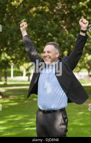 Happy male teacher cheering Stock Photo - Alamy