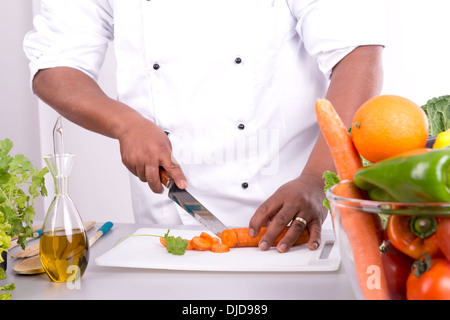 Detail of male chef hands with fruits and vegetables on table Stock ...