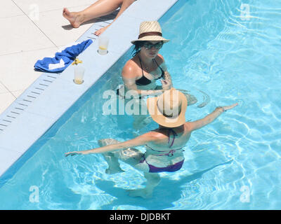Katy Perry takes a dip in the pool wearing black bikini while on a ...