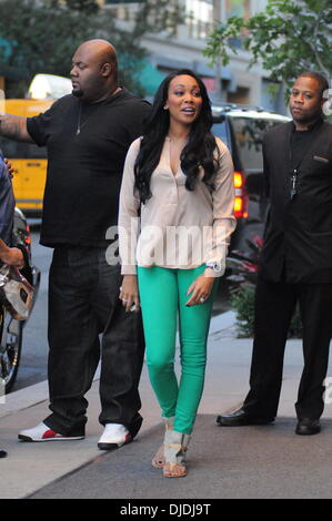 Singer Monica poses for photographers outside of the Trump Soho Hotel ...