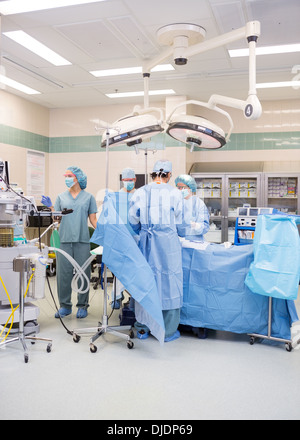 Operating room, teamwork doctors, anesthesiologist, assistants and ...