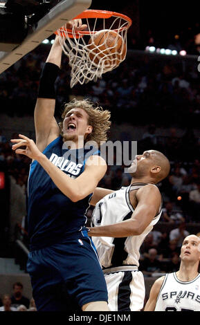 The Dallas Mavericks' Dirk Nowitzki dunks against the Detroit Pistons ...