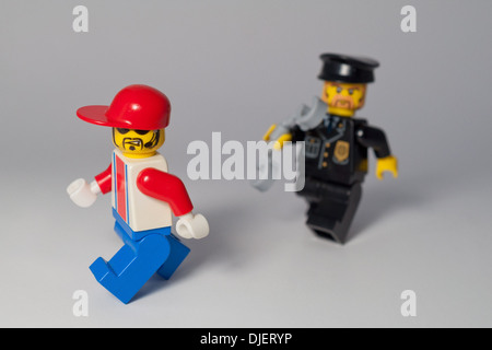 Lego policeman arresting a criminal Stock Photo - Alamy
