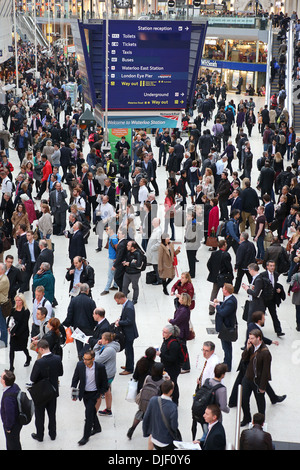 Rush hour at Waterloo train station in London, people going in all ...