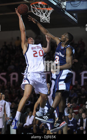 St. Mary's Gaels Diamon Simpson, #20, grabs a rebound in front of ...