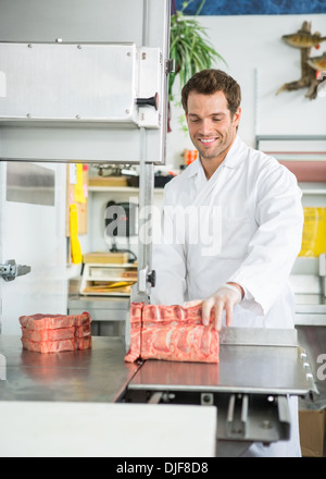 butcher cutting meat Stock Photo - Alamy