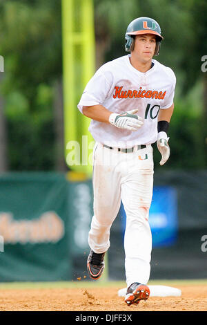 Miami Hurricanes OF Nathan Melendres (10) leads off first base..The ...
