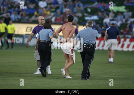 10 July 2010: One of four streakers is taken off the field by Stock ...