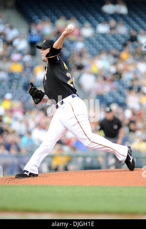 Pittsburgh Pirates starting pitcher Paul Skenes looks down at the ball ...
