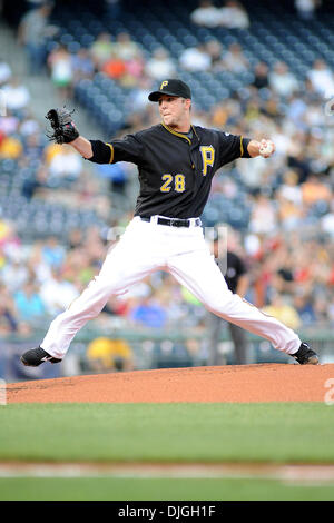 Pittsburgh Pirates starting pitcher Paul Skenes looks down at the ball ...