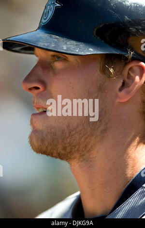 Seattle Mariners' Michael Saunders, left, steals second base ahead of a ...