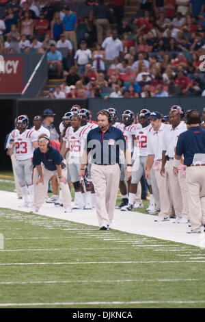 Mississippi football coach Houston Nutt smiles as he looks into the ...