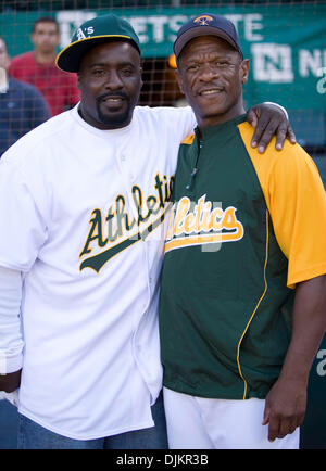 Oakland Athletics Hall of Famer Rickey Henderson, right, sits with team ...