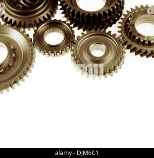 Steel cogs together on plain background Stock Photo - Alamy