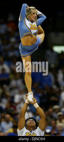 Cheerleaders perform during the second half of an NCAA college ...