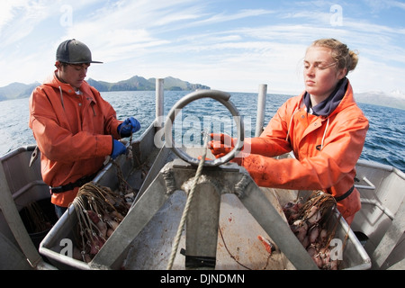 Deckhands Snap Hooks Onto The Groundline While Setting Out Commercial ...