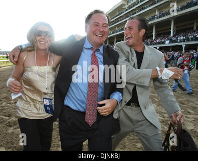 Trainer Rick Dutrow, center, and exercise rider Michelle Nevin, give ...
