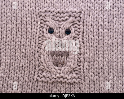 Hand knitted Owl motif pattern on cushion cover in grey wool Stock ...